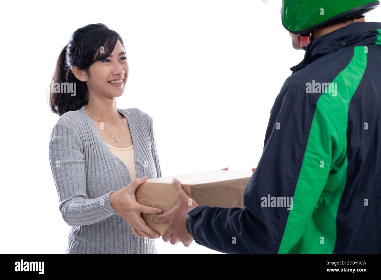 delivery courier with helmet and uniform sending package to female ...