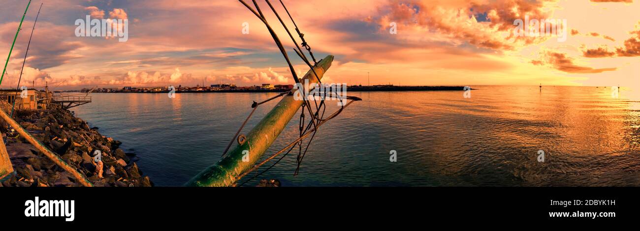 Immersive panoramic golden colored sunset at Tiber river mouth in Rome ...