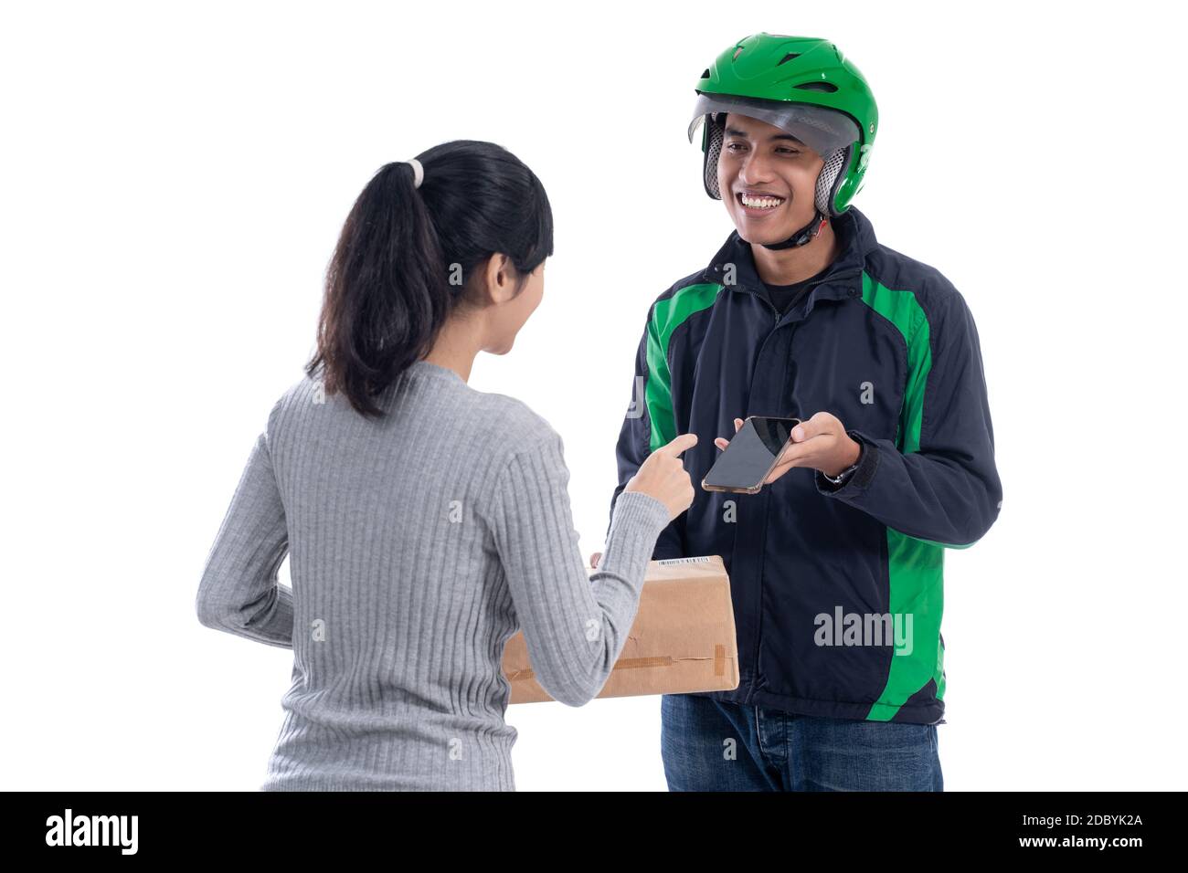 woman signing to package she received from delivery courier Stock Photo ...