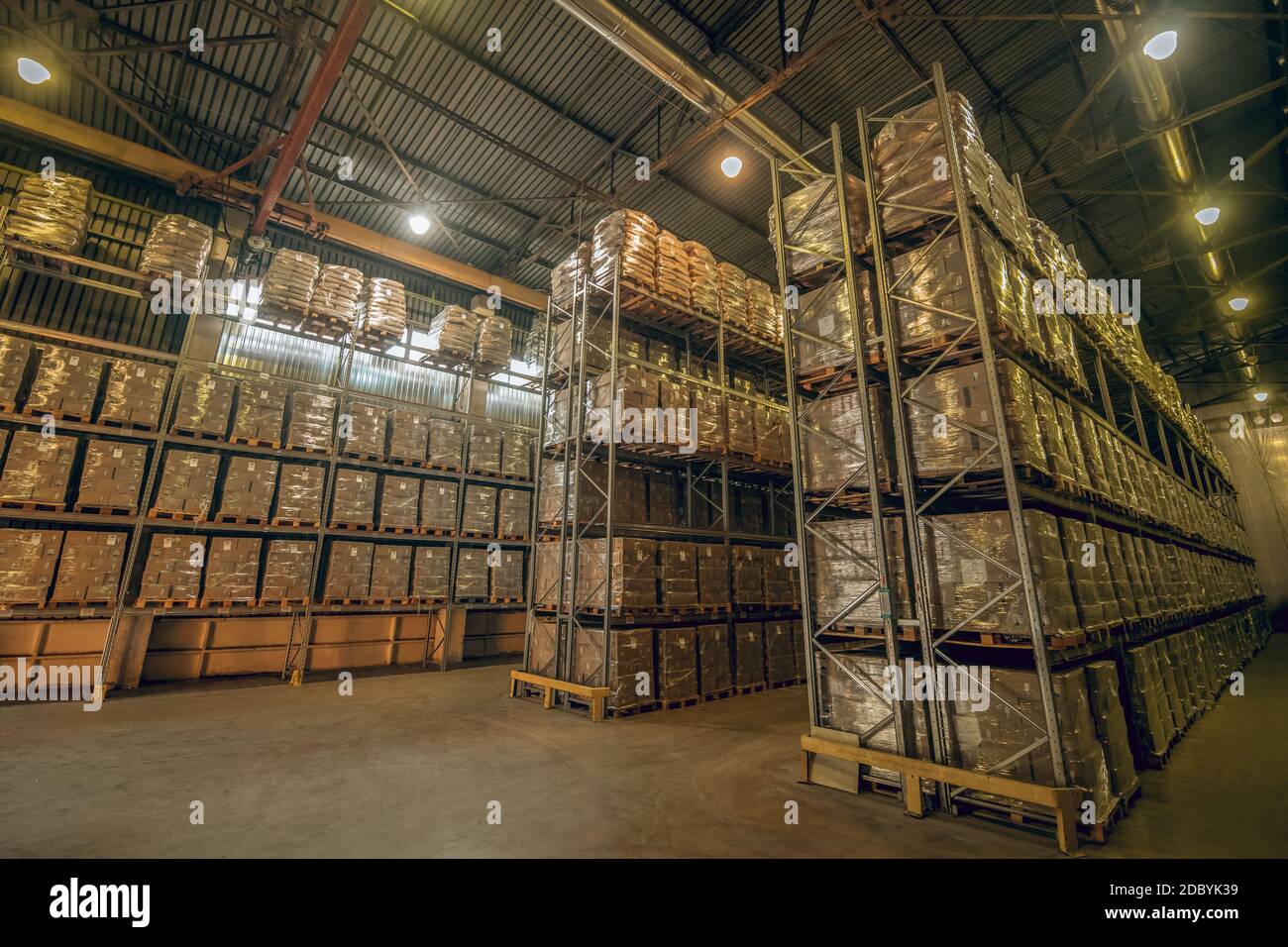 Huge warehouse with many different boxes on the shelves Stock Photo - Alamy