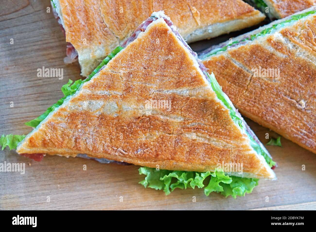 Diagonally cut triangular toast sandwiches Stock Photo - Alamy