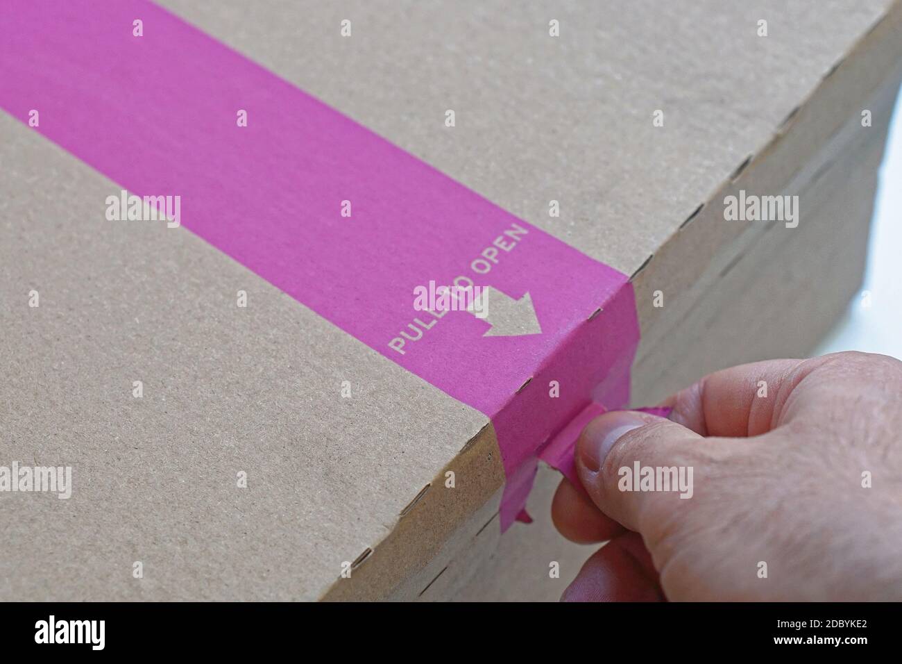 Pull to open strip at box Stock Photo - Alamy