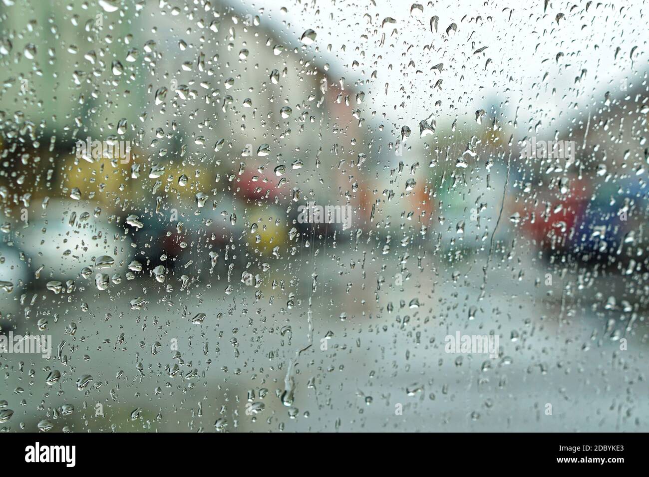 Rainy day abstract weather photo trough wet window Stock Photo - Alamy