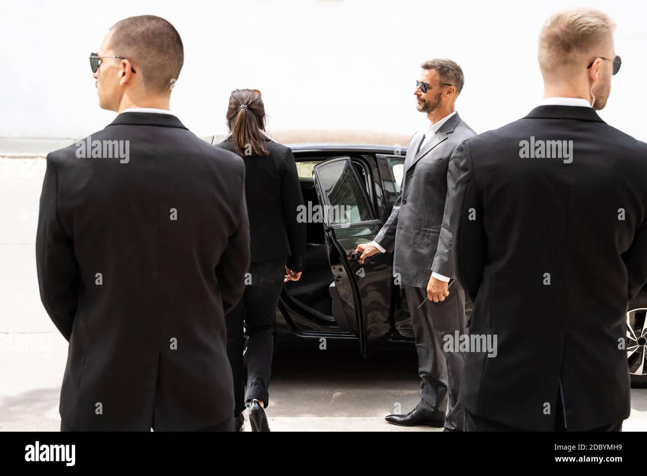 Bodyguards Protecting Businesswoman Opening Car Vehicle Door Stock ...