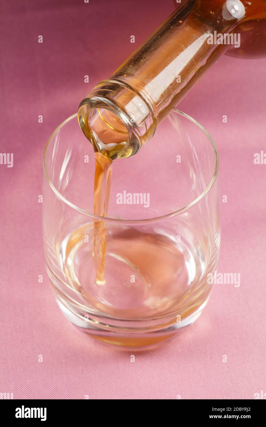 To serve a glass of rum for aperitif Stock Photo - Alamy