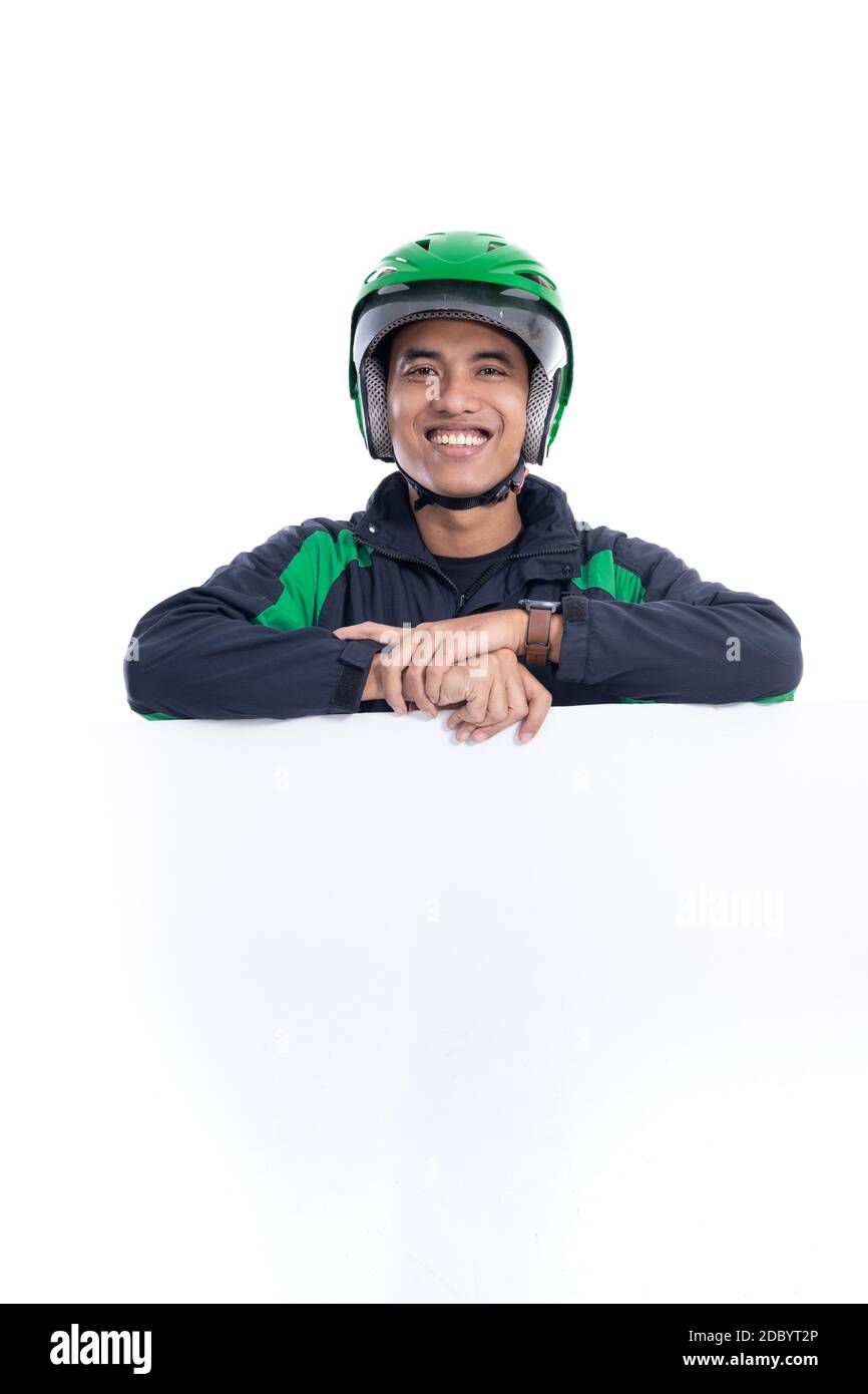 portrait of uber rider with helmet holding blank white board Stock ...
