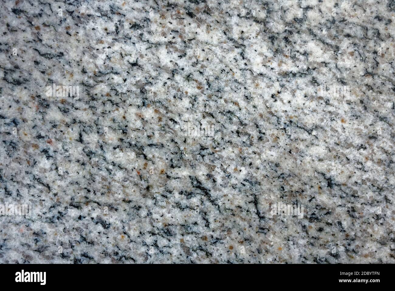 Texture of polished stone. Smooth surface of the granite slab. Abstract ...