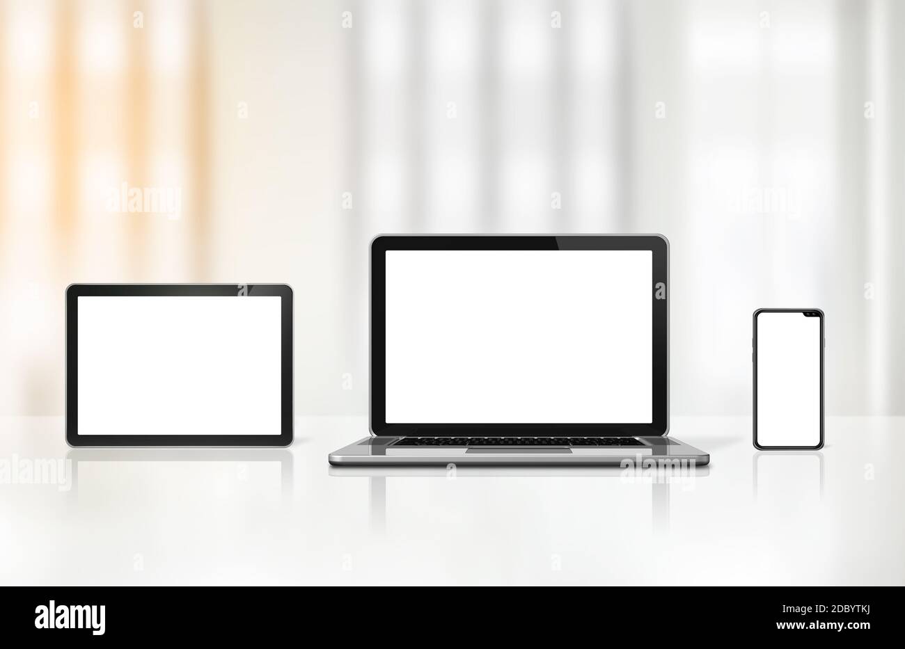 Laptop, mobile phone and digital tablet pc on office desk interior ...