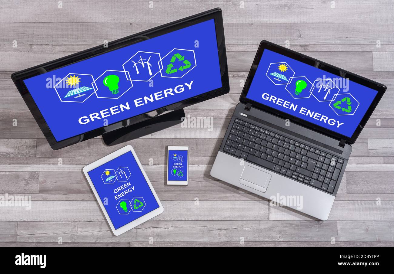 Green energy concept shown on different information technology devices ...