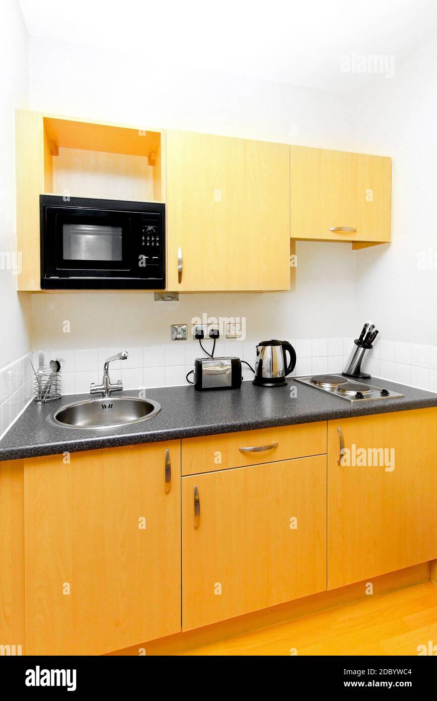 Practical kitchen for small space in studio apartment Stock Photo - Alamy
