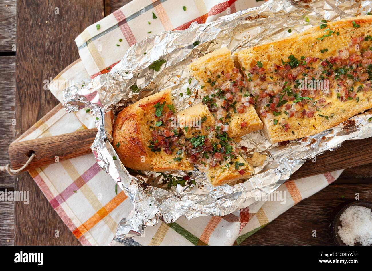 Crispy baguette with egg and bacon bits Stock Photo - Alamy