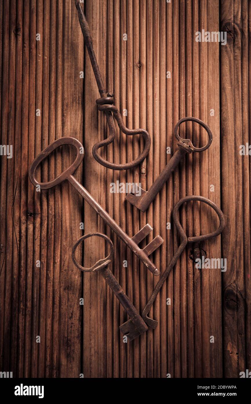 Assortment of vintage keys on wooden background. Top view Stock Photo ...