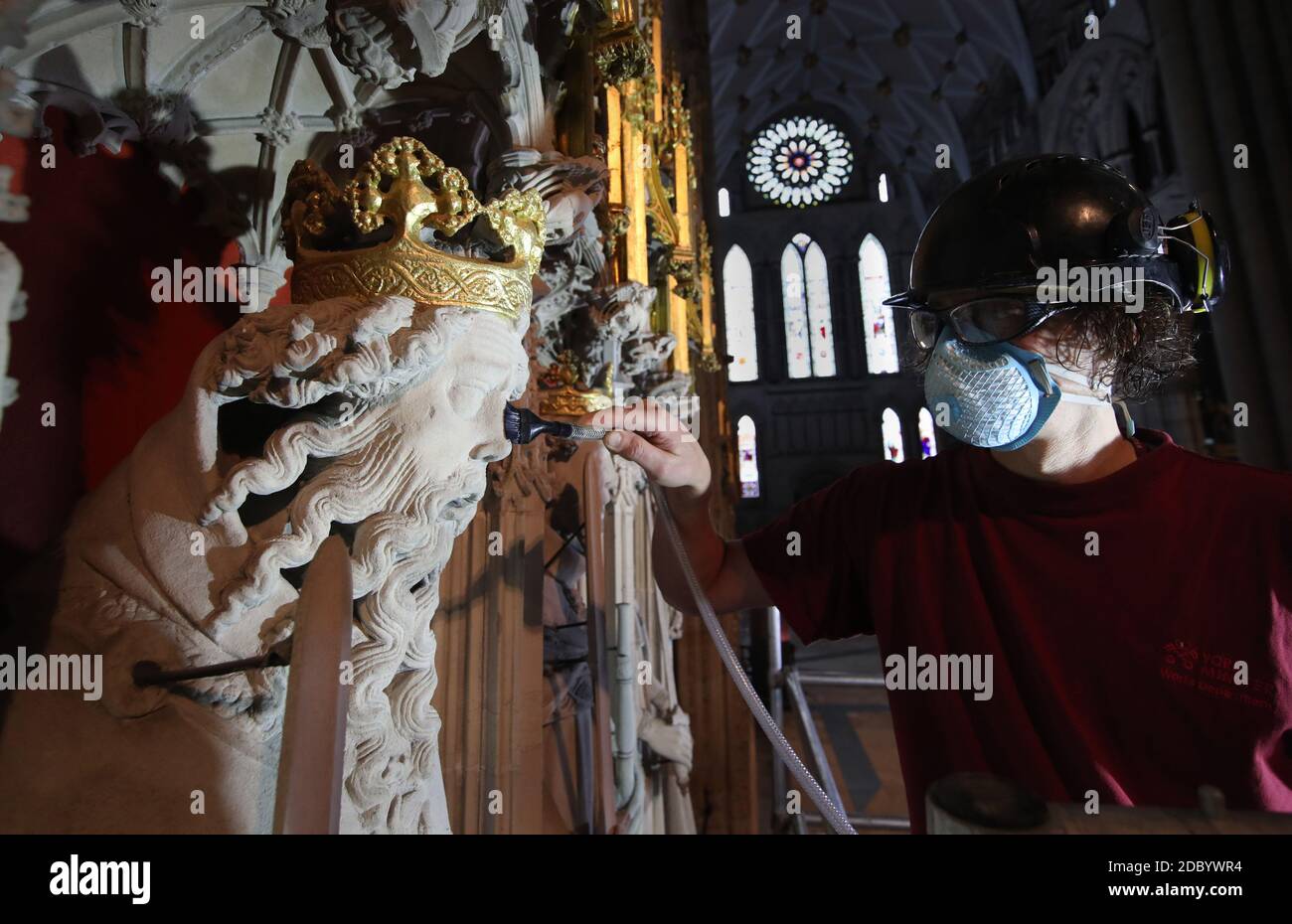 Conservation workers using museum grade vacuums and brushes begin the ...