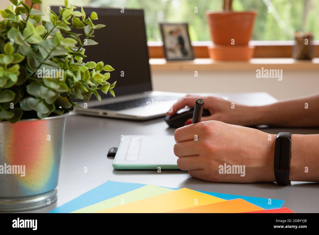 Beautiful graphic designer drawing digital design on a drawing tablet ...