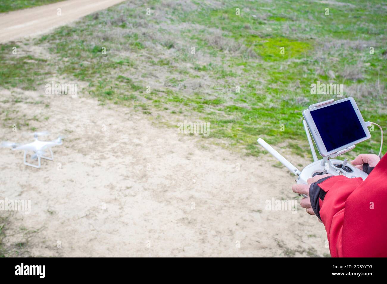 Pilot flying drone on taking off maneuver. FPV or First Person View ...