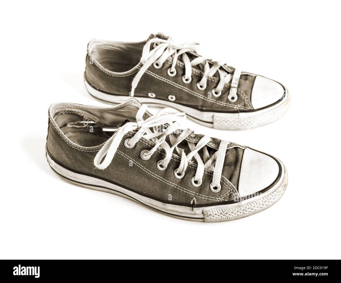 Old black generic sneakers isolated on white background Stock Photo - Alamy
