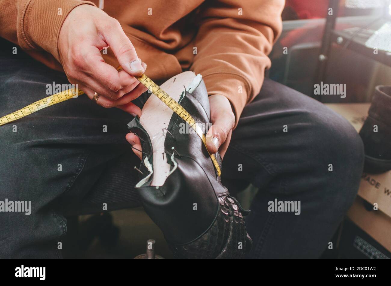 Shoemaker making shoe using shoemaker tools in workshop Stock Photo - Alamy
