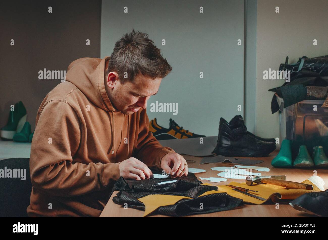 Process of making a sneaker by a shoemaker. Shoe designer making a ...