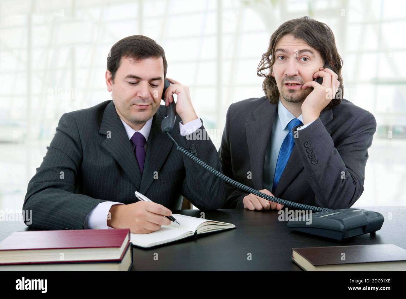 business team working at a desk, at the office Stock Photo - Alamy