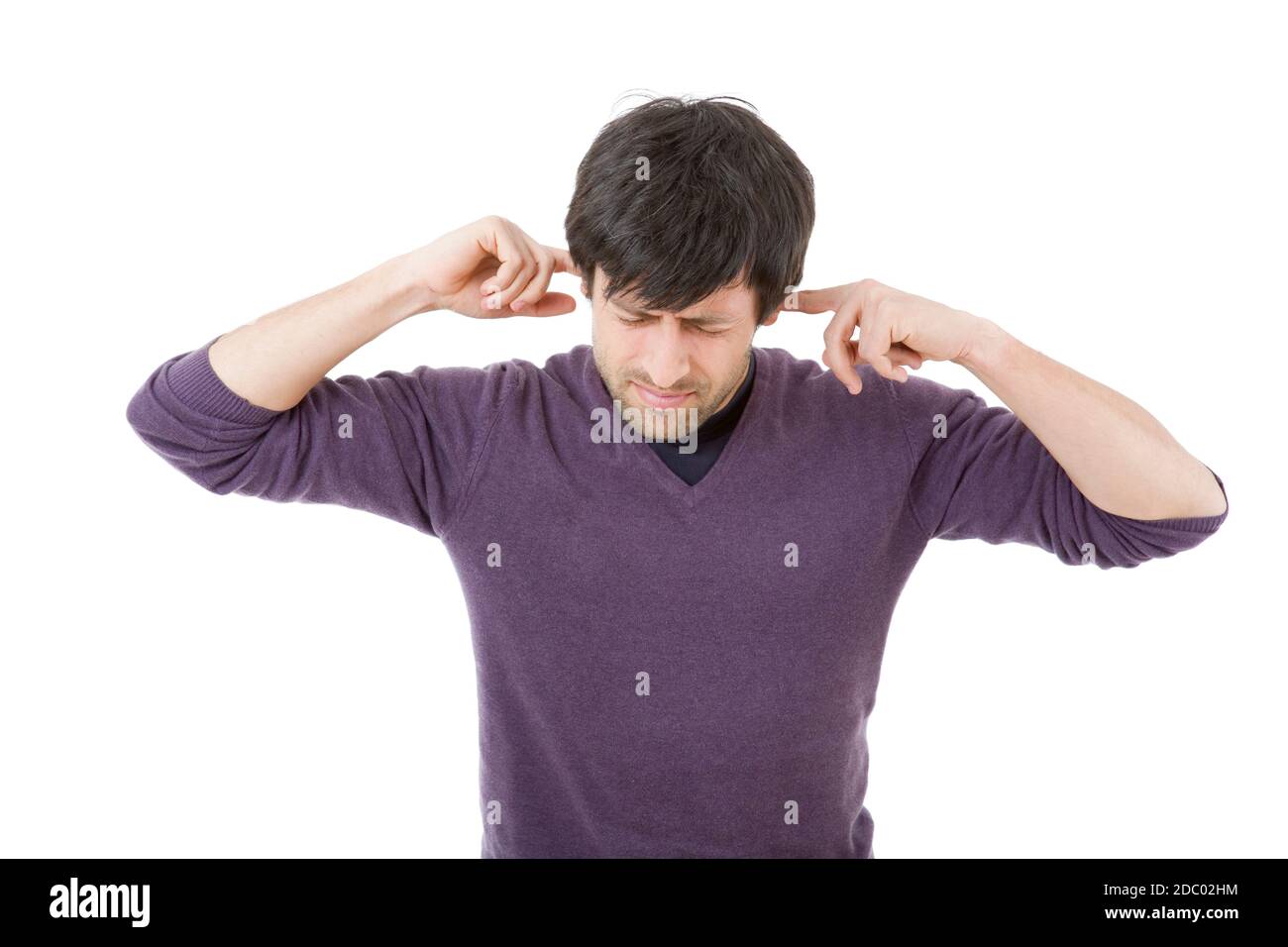 handsome young man covering his ears, isolated white background Stock ...