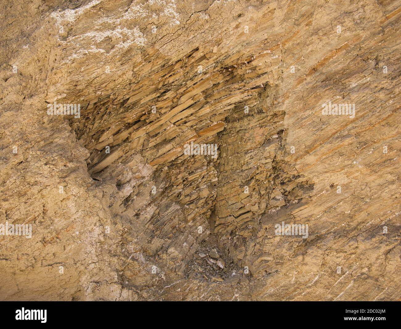 Very well recognizable layers of stone with shades of color in a rock ...