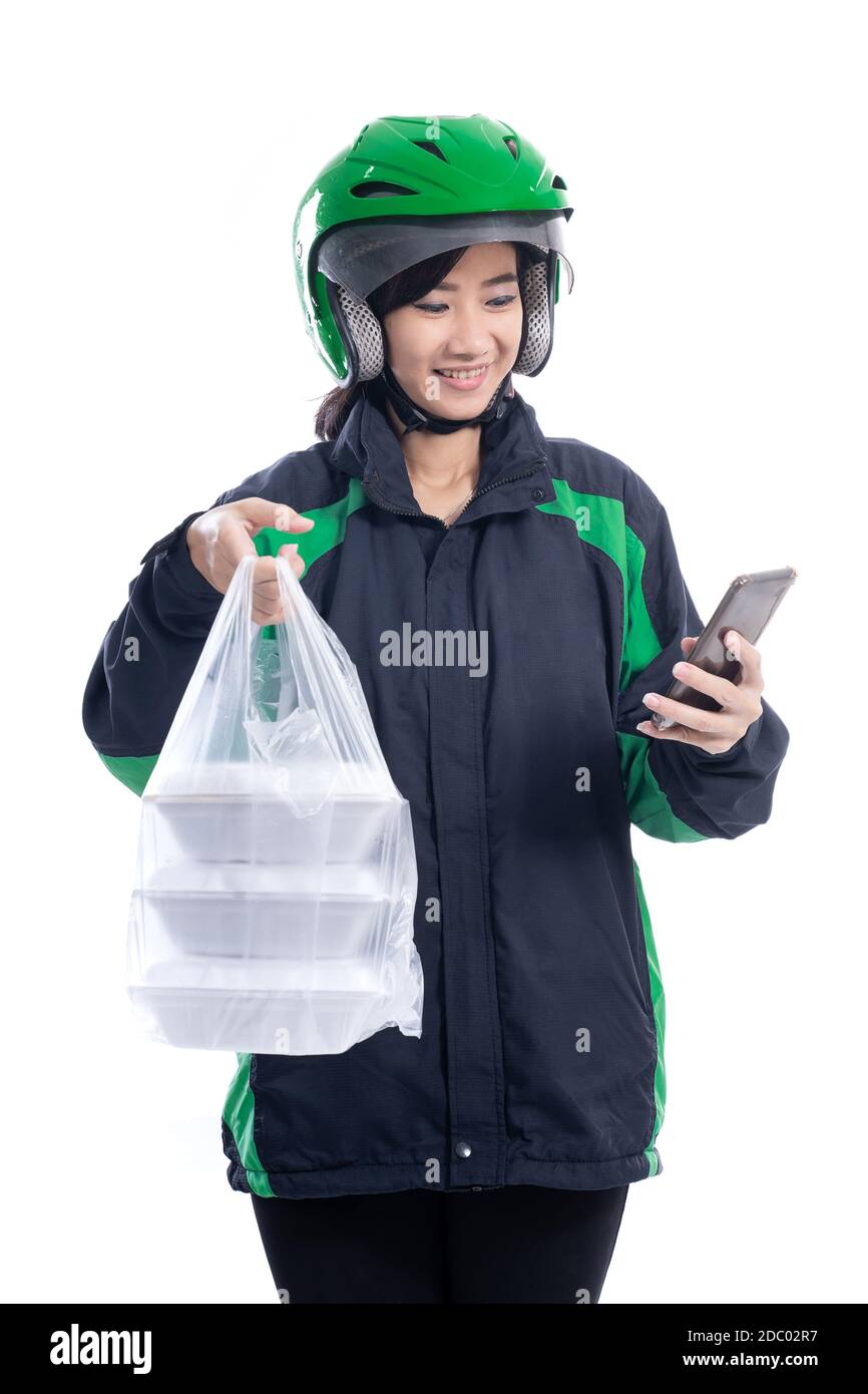 asian woman delivery food. female courier with food on a plastic bag ...