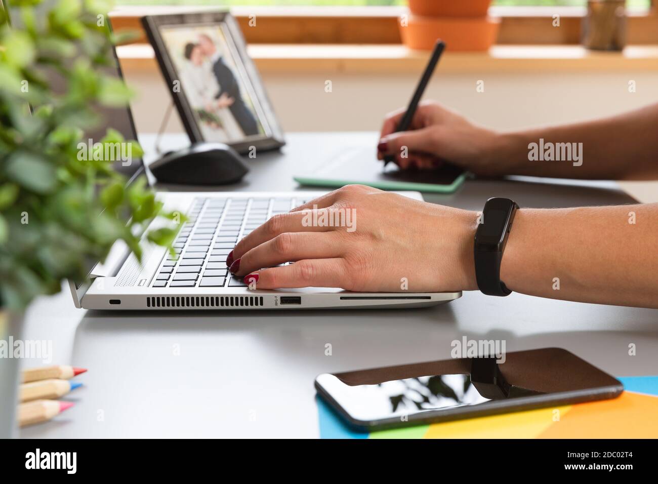 Beautiful graphic designer drawing digital design on a drawing tablet ...