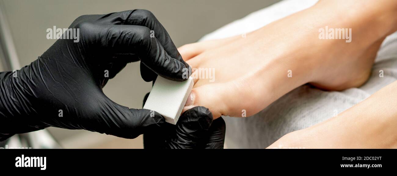 Woman nail buffing hi-res stock photography and images - Alamy