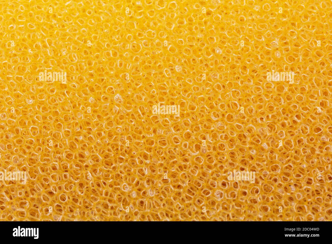 Yellow sponge texture Stock Photo - Alamy