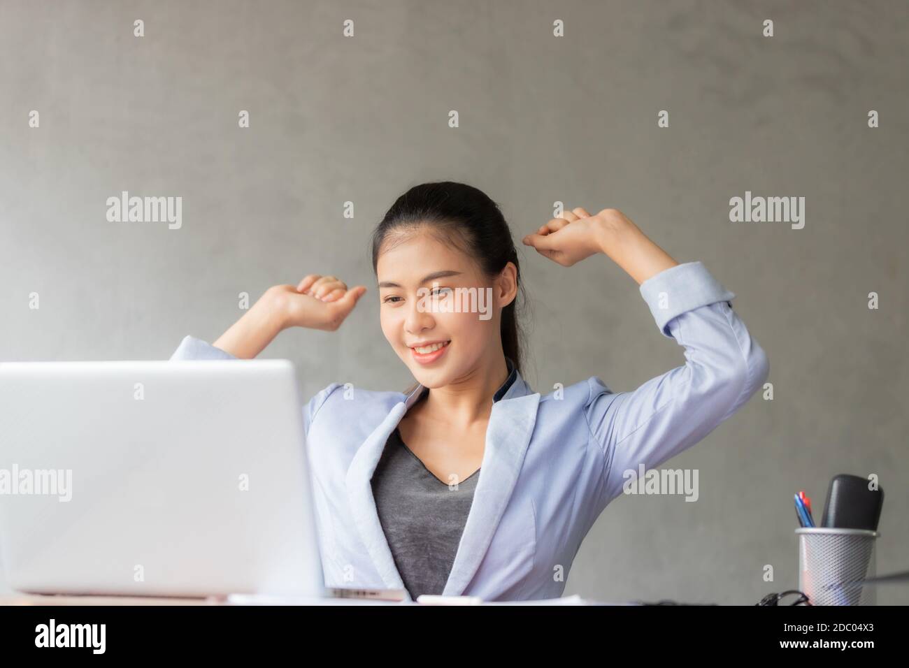 Business women or working lady are stretch oneself or lazily for ...