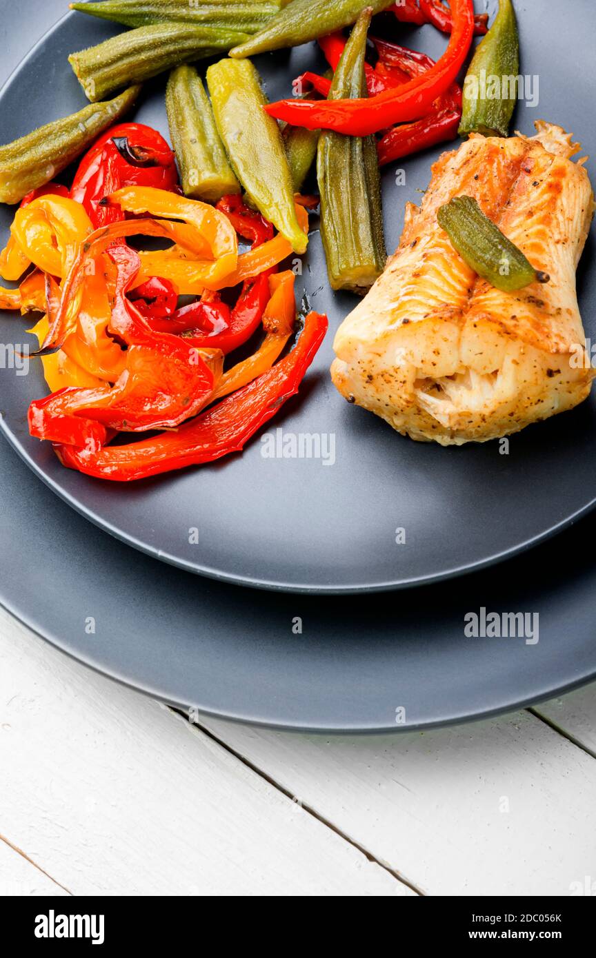 Baked fish with okra and red pepper.Fish grenadier Stock Photo - Alamy