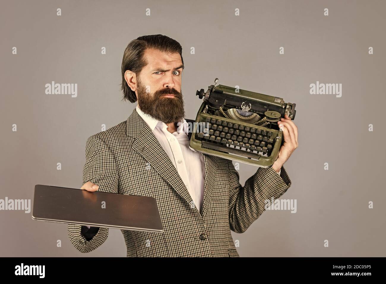 what to choose. mature man hold vintage device. first draft ...