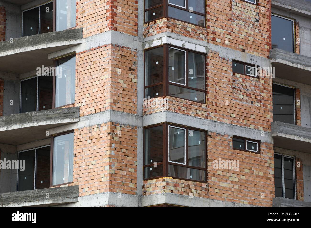 Newly built building in a residential complex. New construction site ...