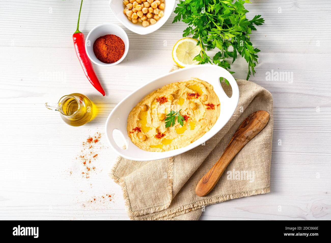 hummus paste with lemon and chilli on white background Stock Photo - Alamy