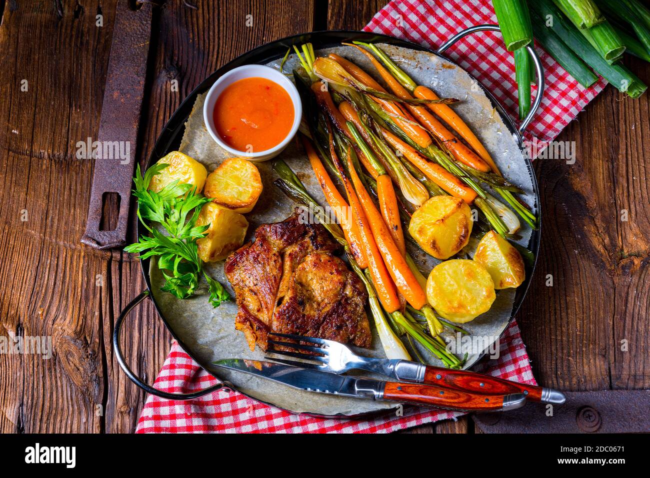 grilled neck chops with caramelized vegetables Stock Photo - Alamy