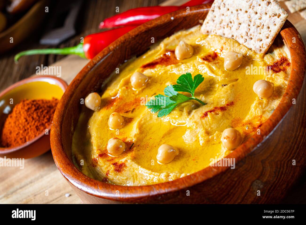 Delicious hummus paste with lemon and chilli Stock Photo - Alamy