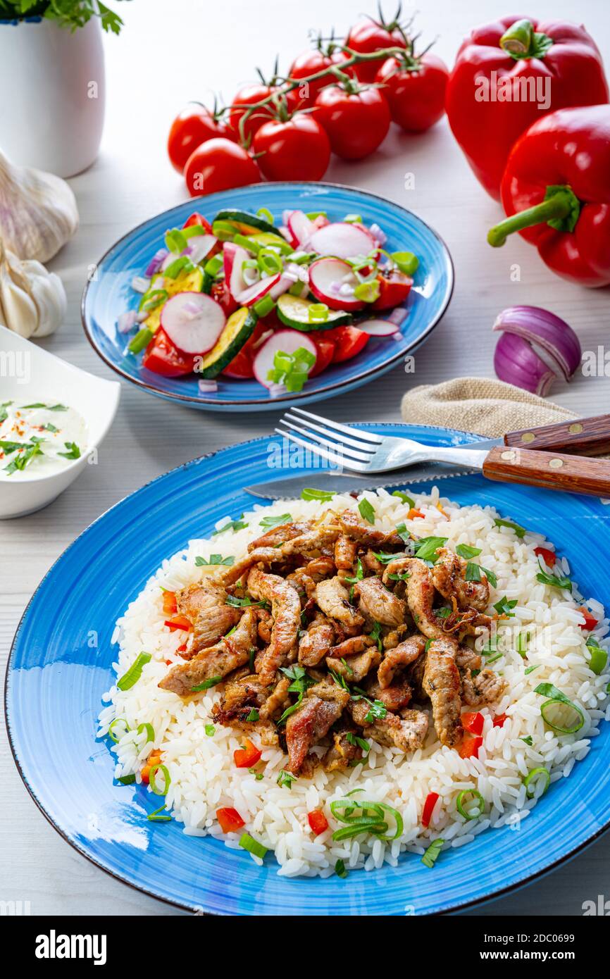 gyros with rice and green salad and zaziki Stock Photo - Alamy
