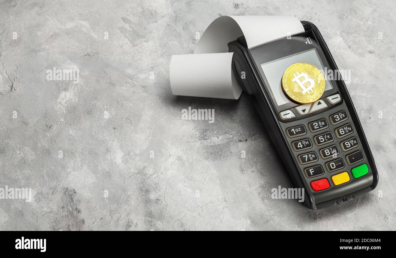 Bitcoin payment. Pos terminal and Bitcoin coin. Copy space for text ...