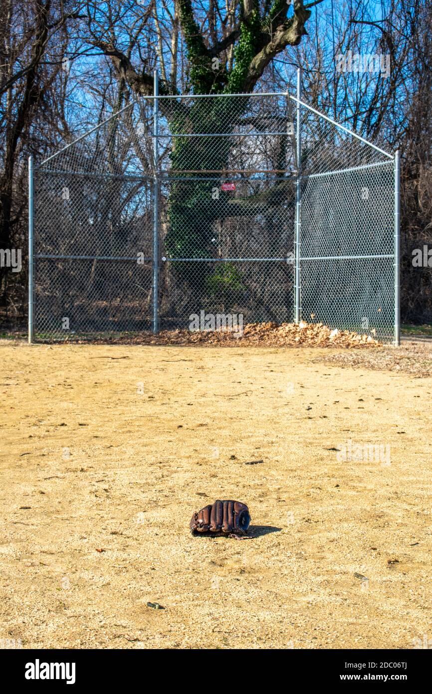 A Forgotten Baseball Glove on a Sand Baseball Field Stock Photo - Alamy