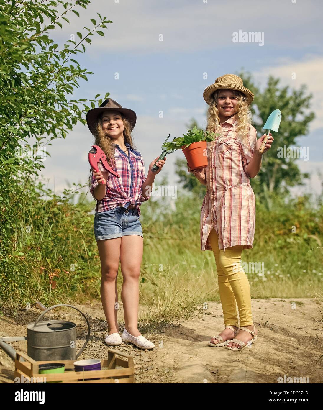 On way to family farm. Taking care of plants. Girls with gardening ...