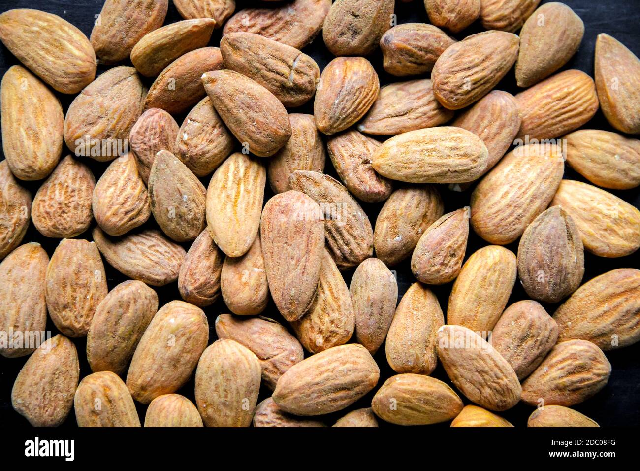 Fresh organic almond background wallpaper. Top view Stock Photo - Alamy