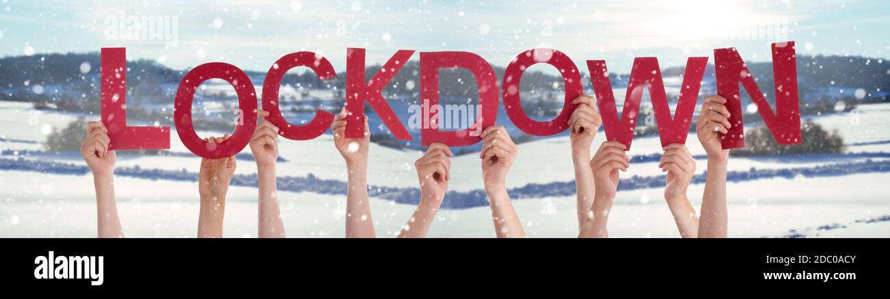 People Hands Holding Colorful English Word Lockdown. Snowy Winter ...
