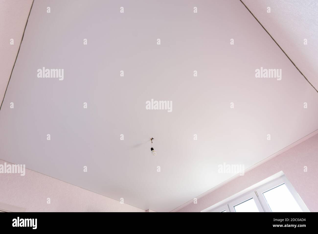 Stretch matte white ceiling in the interior of a square room Stock ...