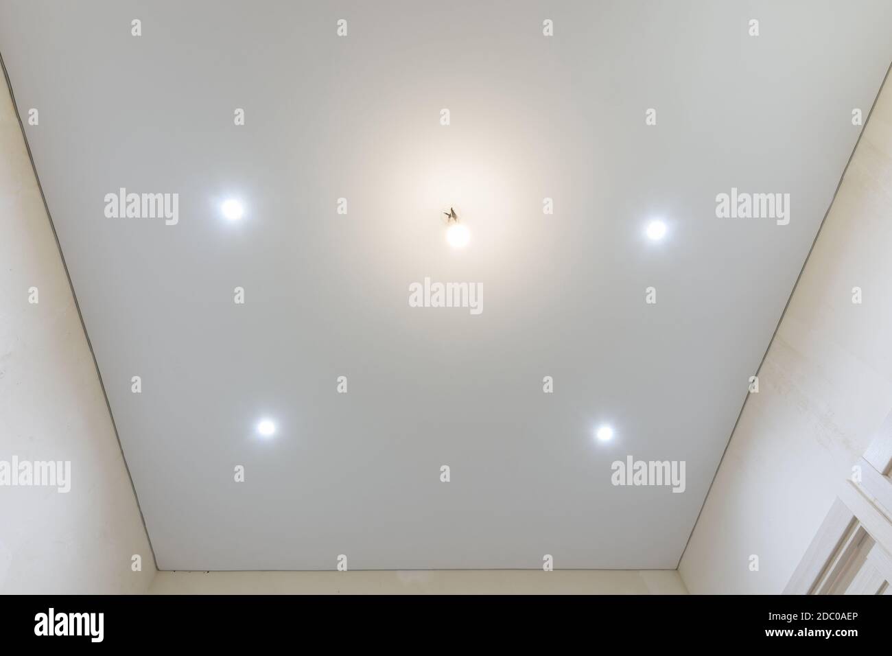 Matte vinyl stretch ceiling in the interior of the room, spotlights ...