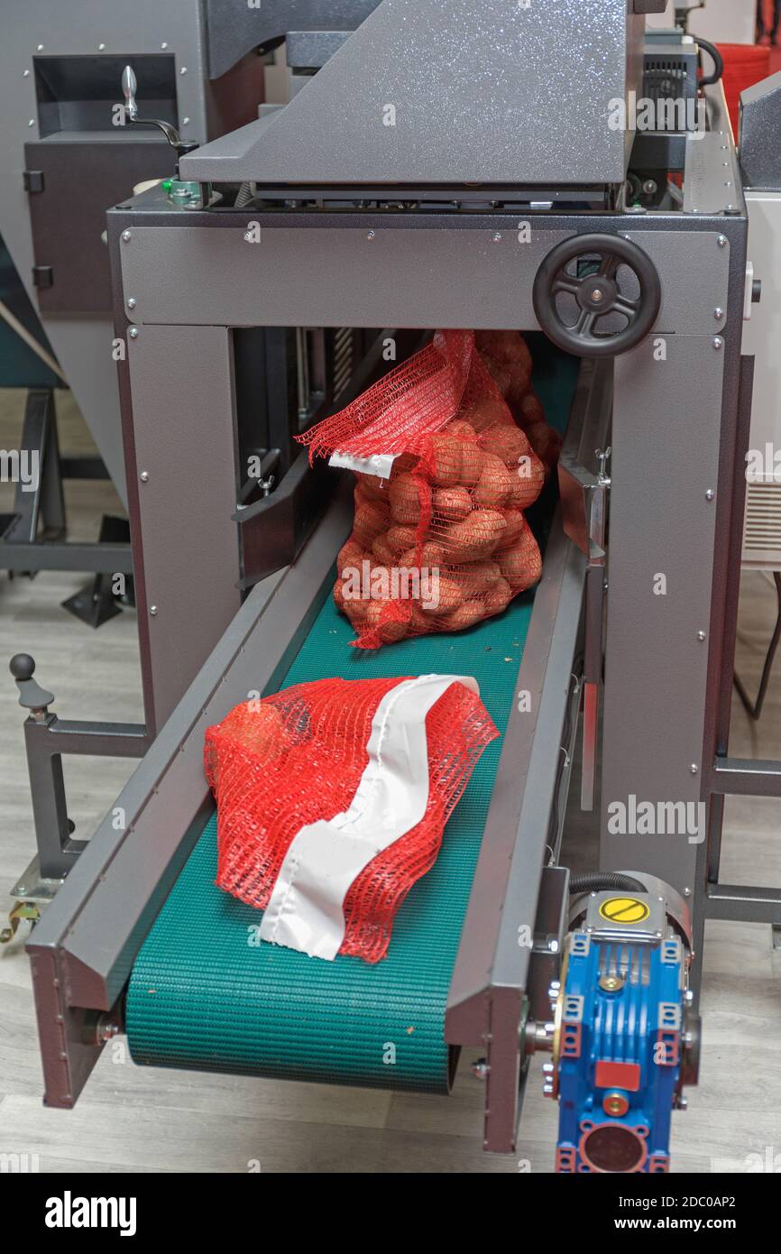 Potato Packing in Sack Bags Conveyor Belt Machine Stock Photo - Alamy