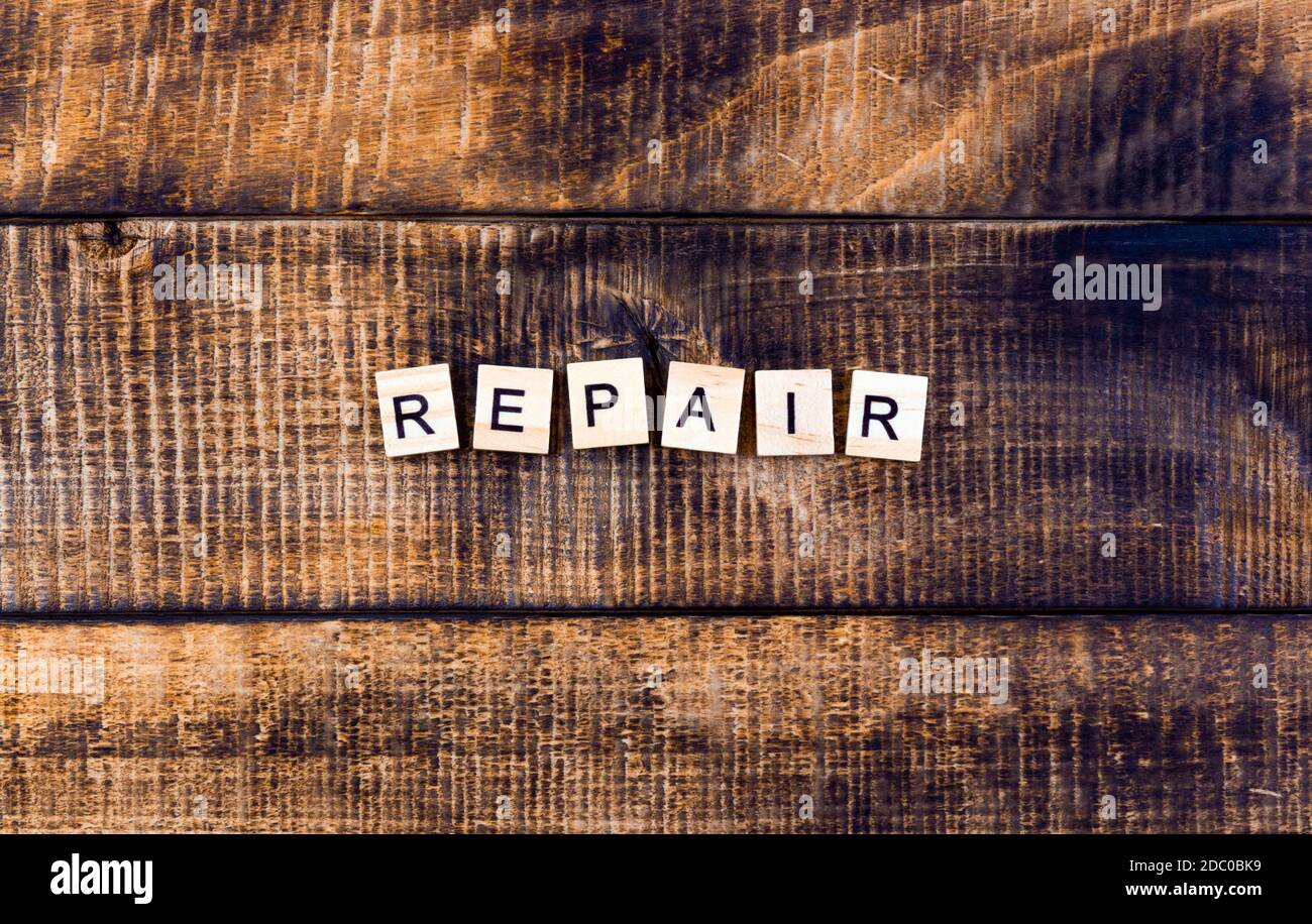 Repair word on wooden background. Collage of tools Stock Photo - Alamy