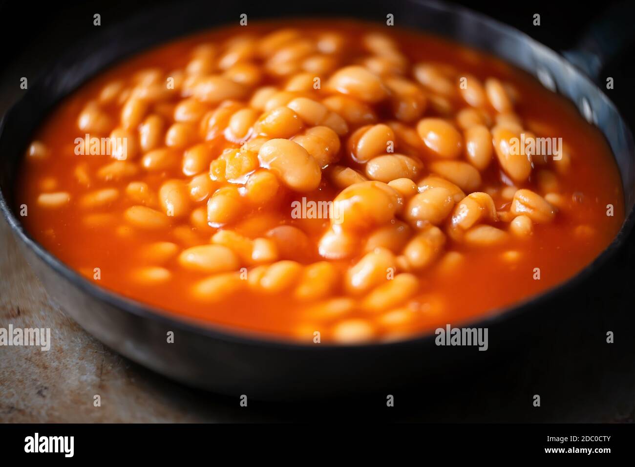 close up of rustic english baked beans in tomato sauce Stock Photo - Alamy