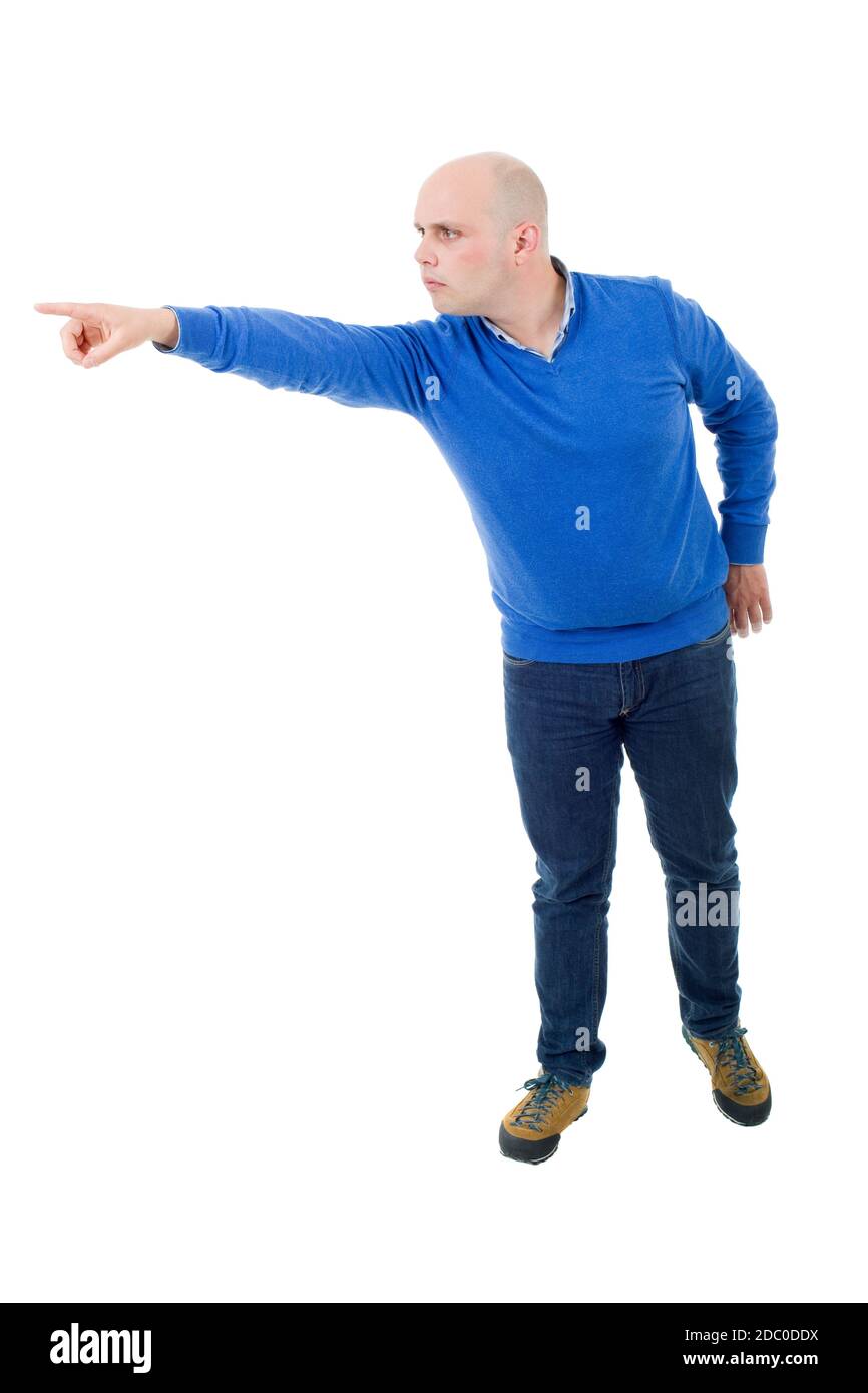 young casual man full body, pointing, isolated on a white background ...