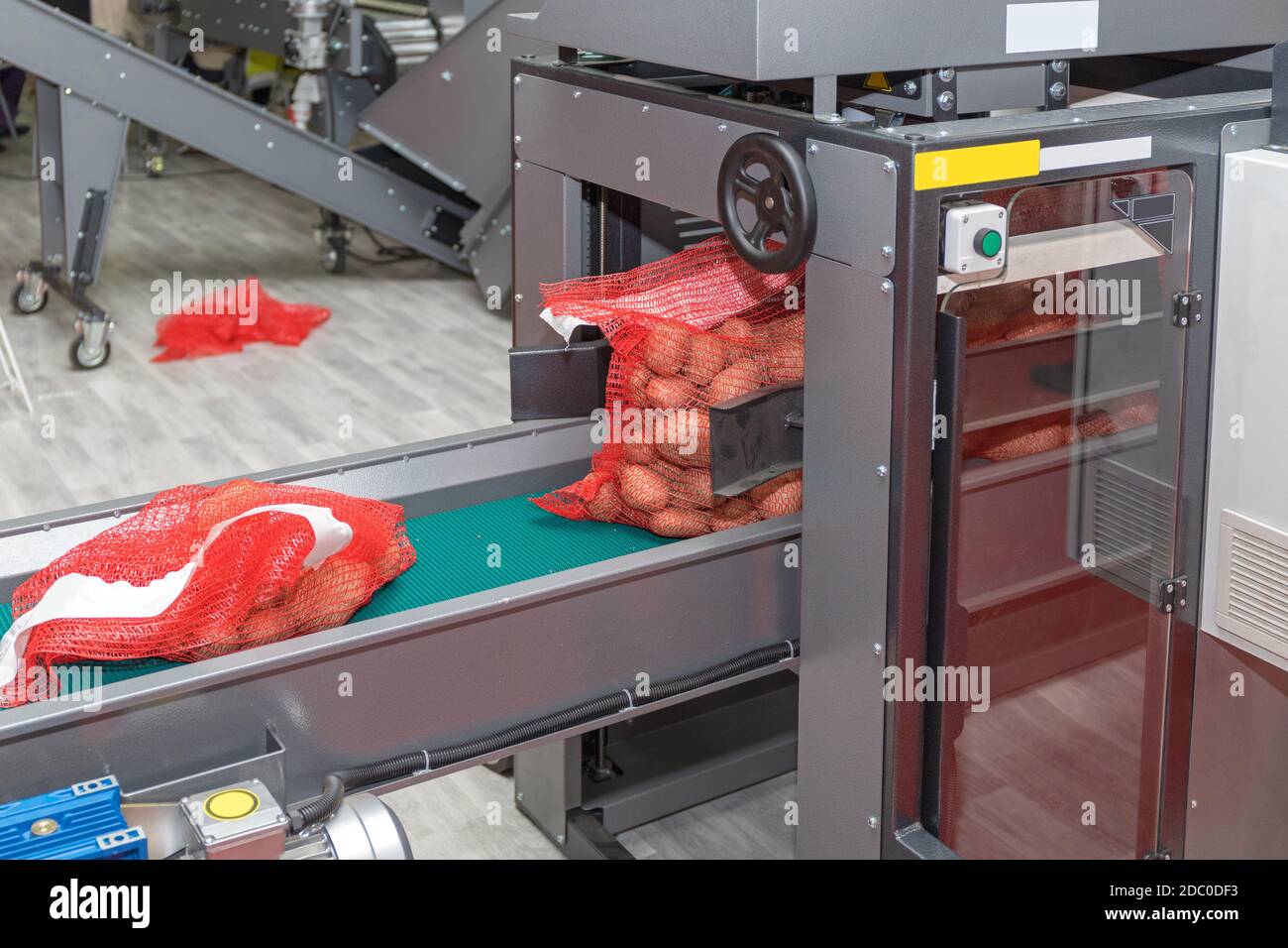 Potato Packing in Sack Bags Conveyor Belt Machine Stock Photo - Alamy