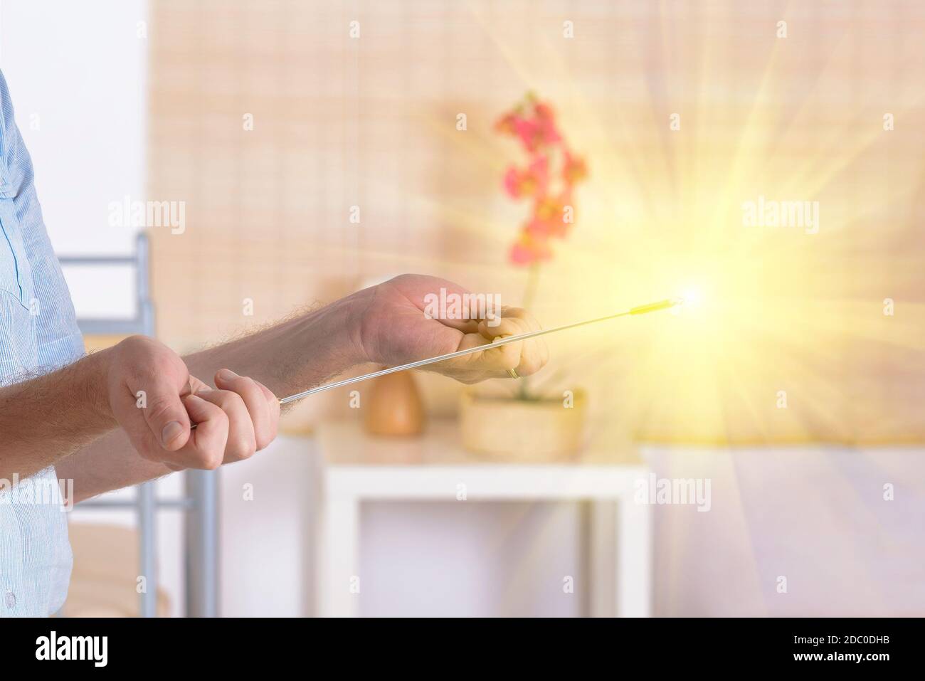 Man dowsing wirh dividing rod to locate ground water under surface or ...